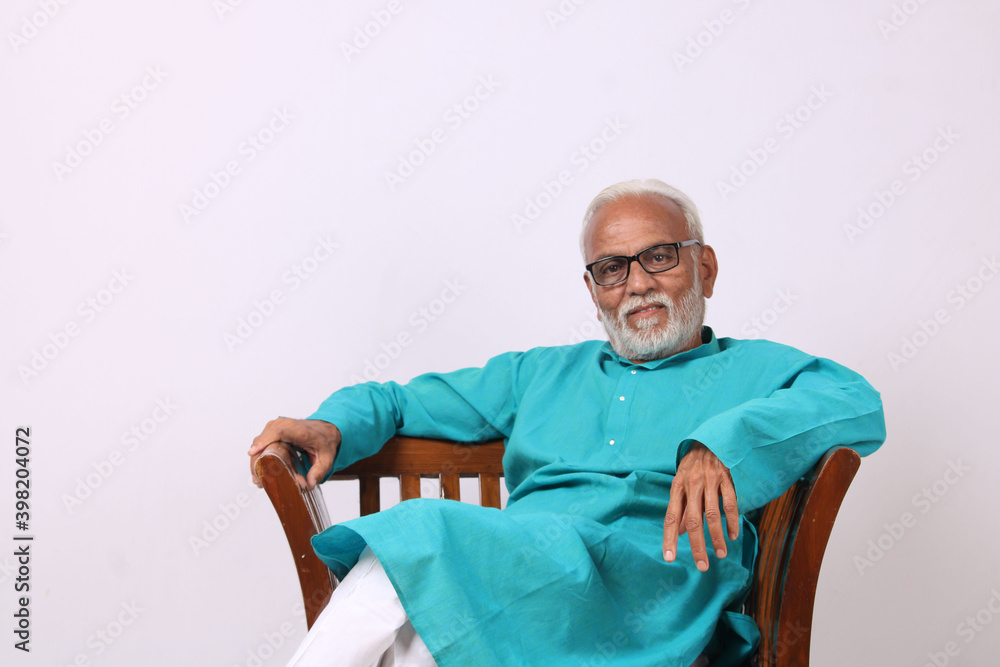 Senior Indian man relaxing or sitting on chair. Stock Photo | Adobe Stock