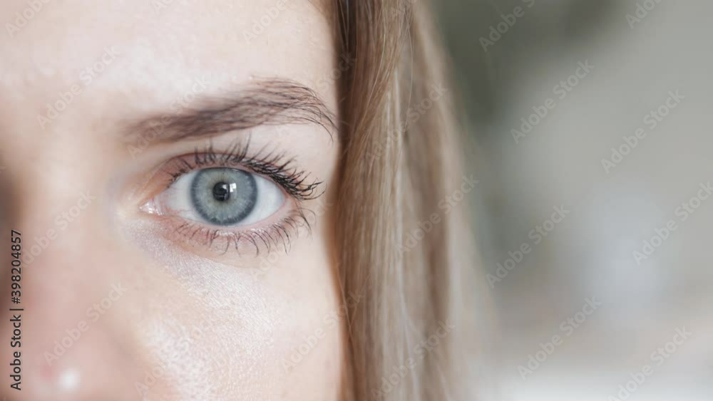 close up macro blue eye opening human iris natural beauty. Attractive ...