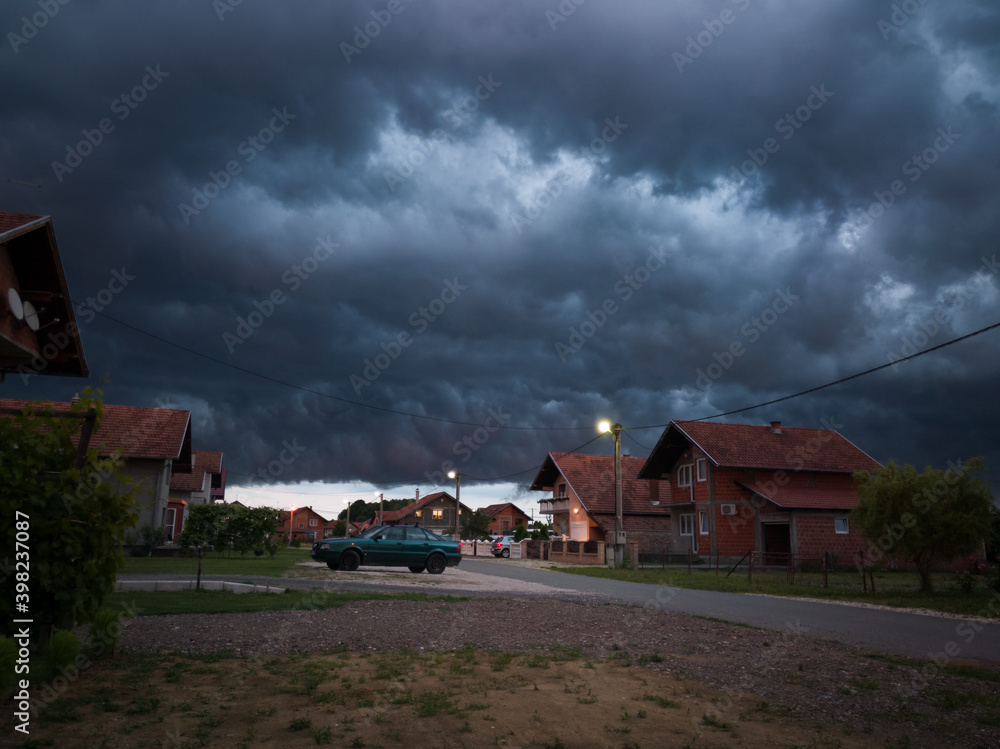 Stormy severe weather during storm with dark scary clouds, above ...