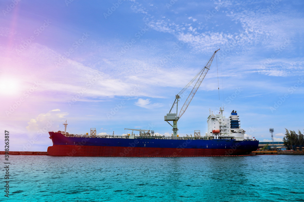 Shipyard Side View cargo ship, Vessel mooring alongside in the blue sea ...