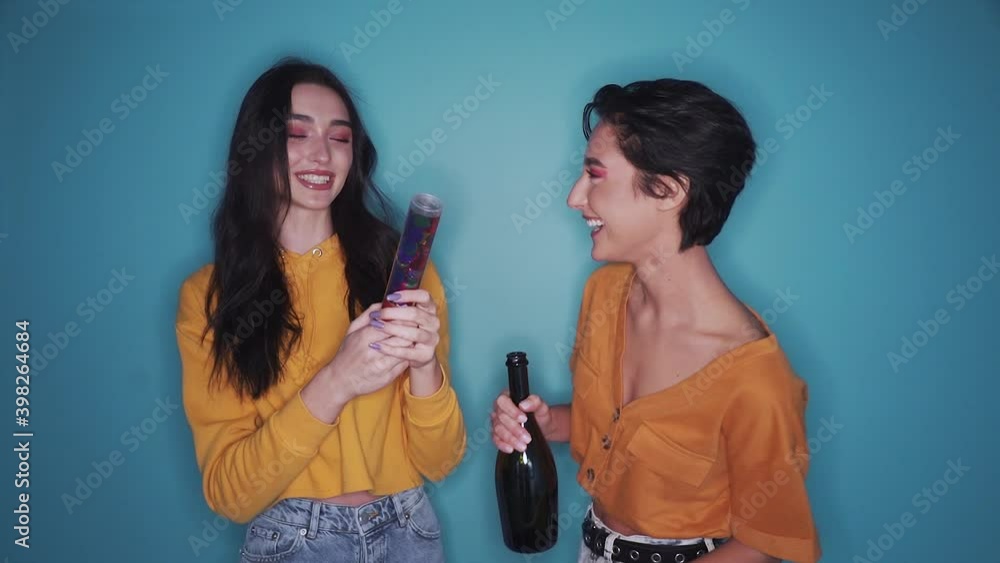 Two happy pretty stylish cool diverse gen z girls having fun ...