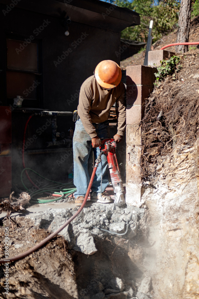Jackhammering a thick concrete slab Stock Photo | Adobe Stock