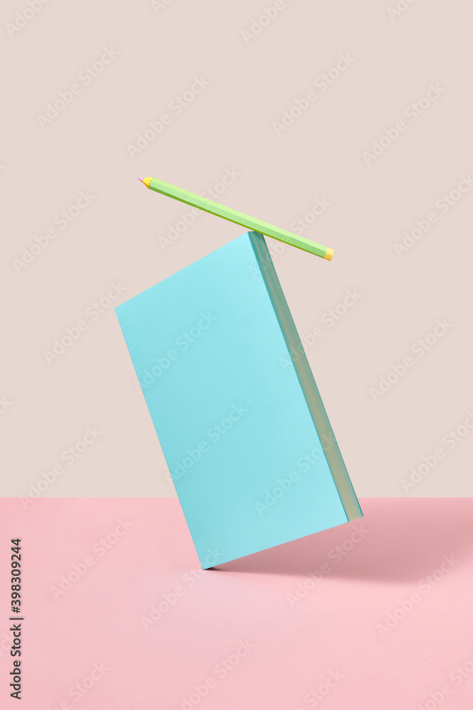 Balancing composition from pencil and notebook. Stock Photo | Adobe Stock
