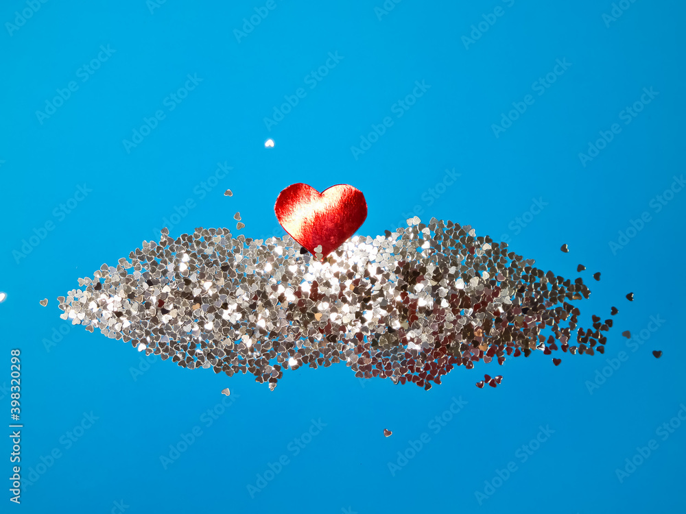 Valentine's day. Many small decorative hearts are piled in a pile in ...