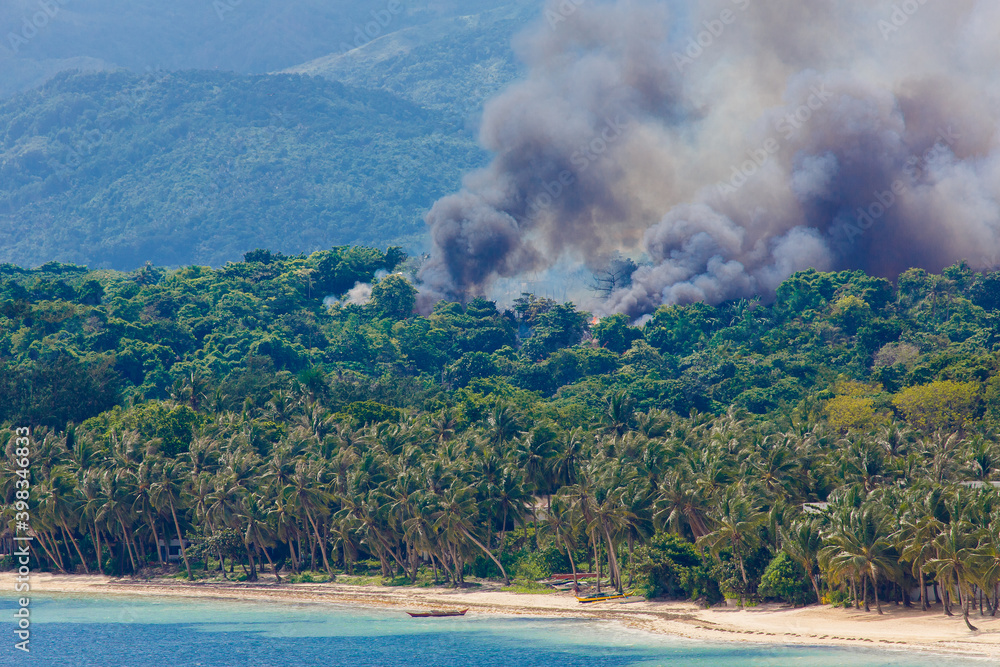 Fire on the tropical island of Boracay Philippines. Natural disaster ...