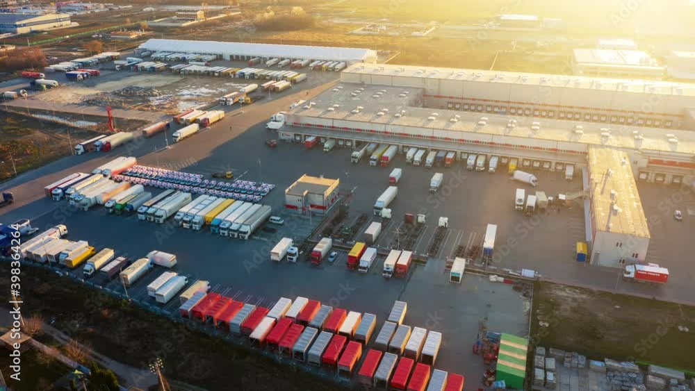 Logistics park with a warehouse and loading hub. Semi-trailer trucks ...