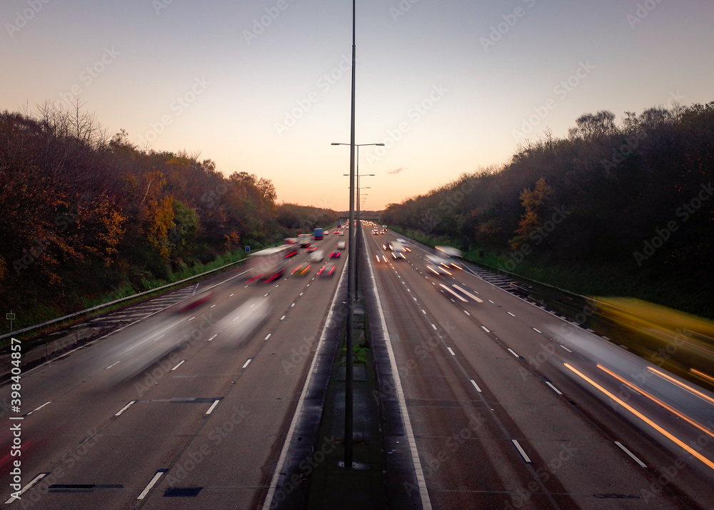 Motion blurred view of traffic on the M25 motorway in south east ...