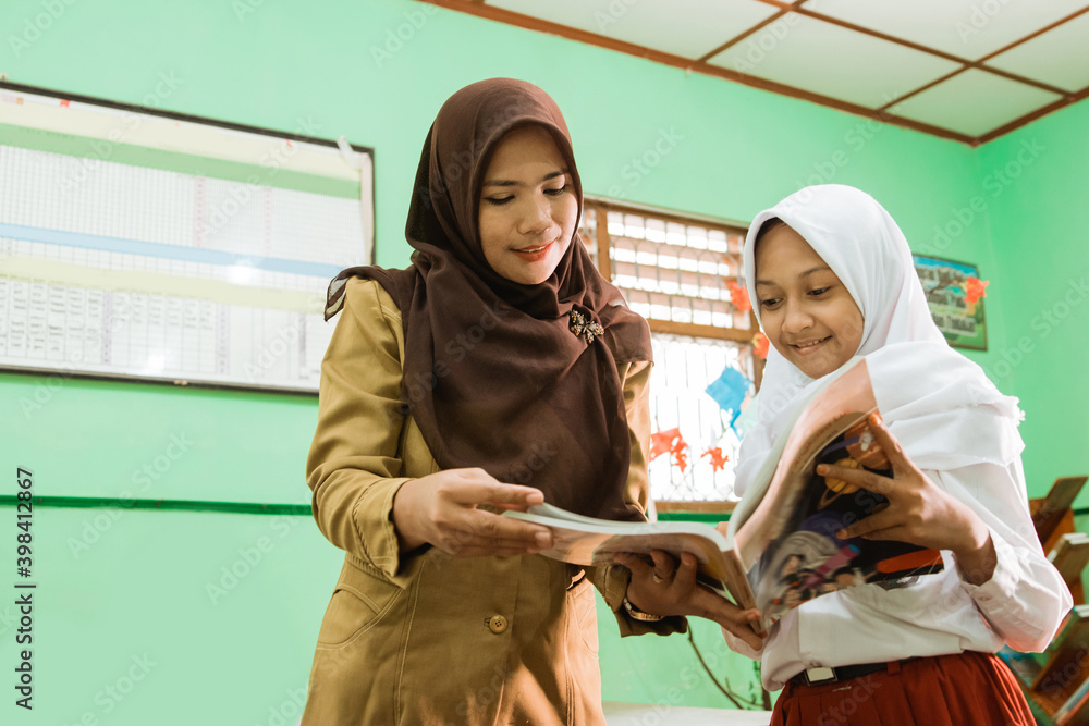 teachers who are helping their students in lessons Stock Photo | Adobe ...
