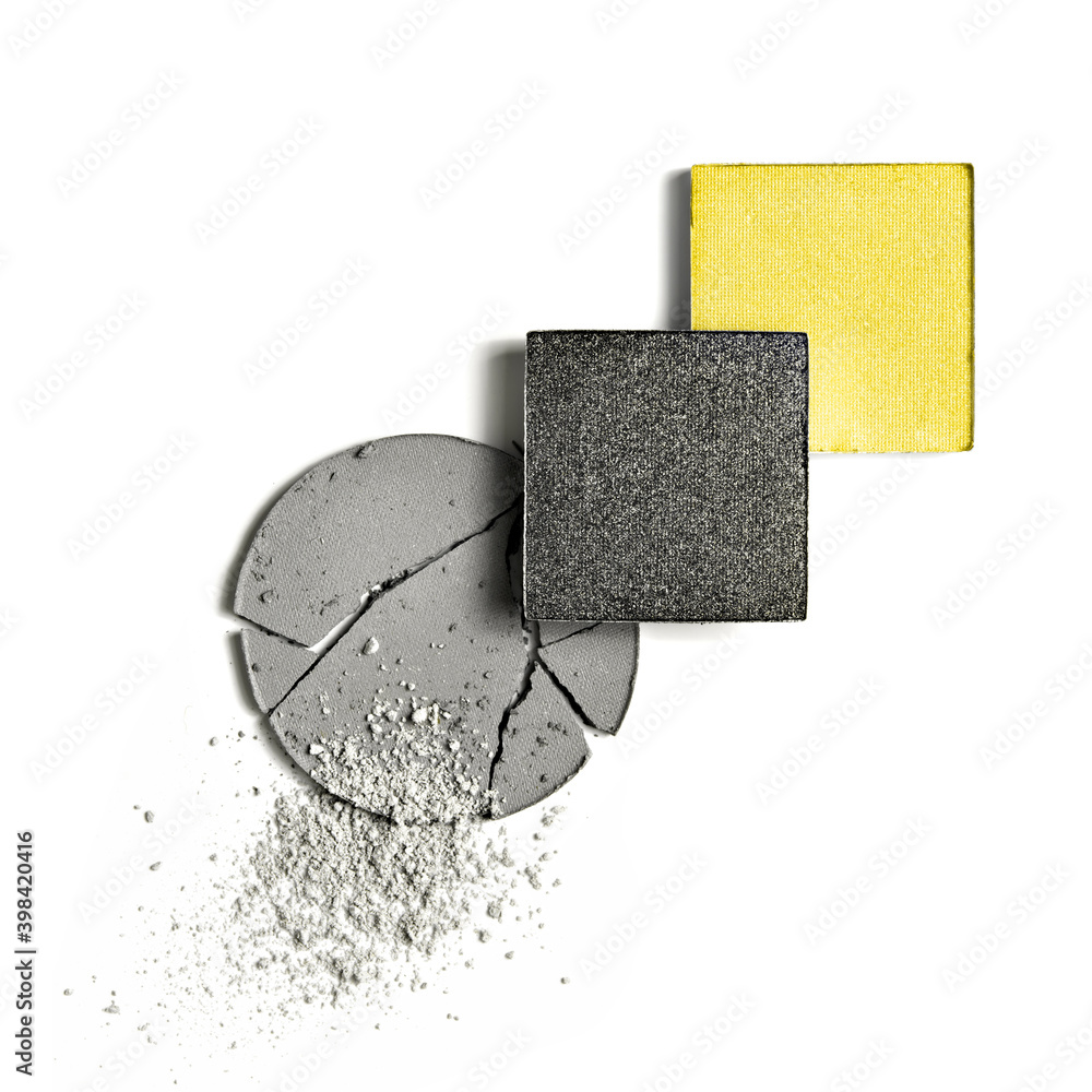 Broken square and round eyeshadows and scattered makeup of main colour ...