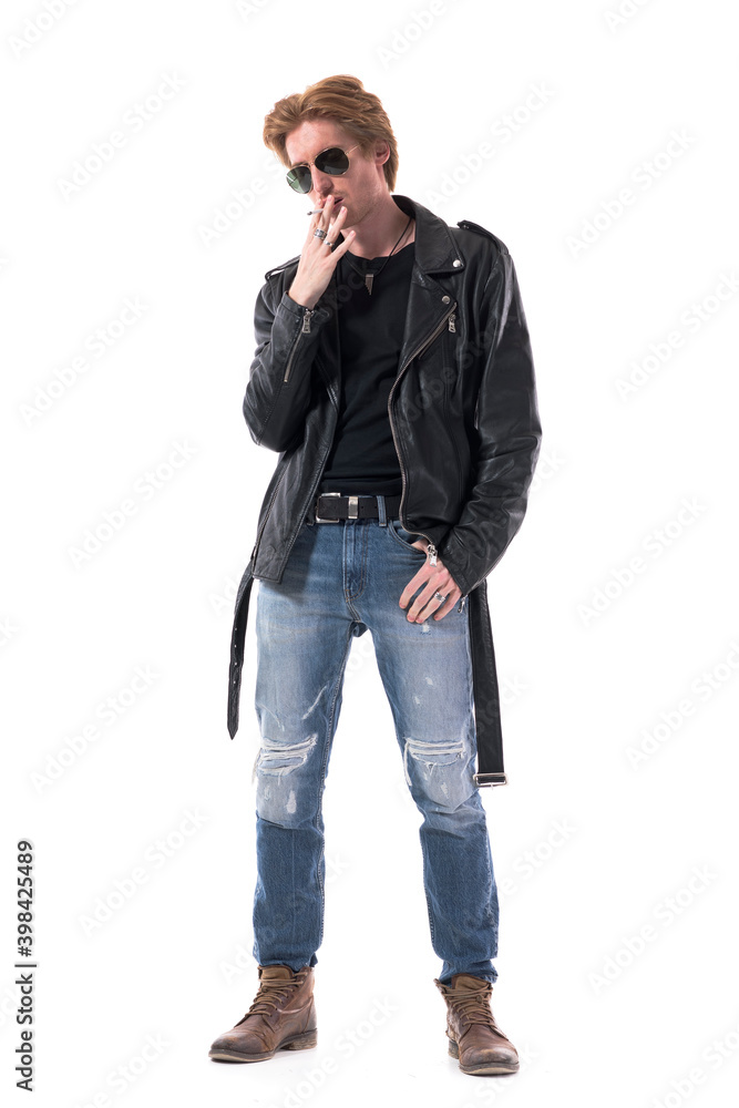 Cool serious young biker or rocker with sunglasses in leather jacket ...