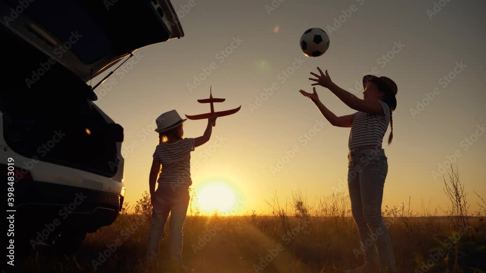 Happy children sunset play ball, airplane.Happy family spend fun summer ...