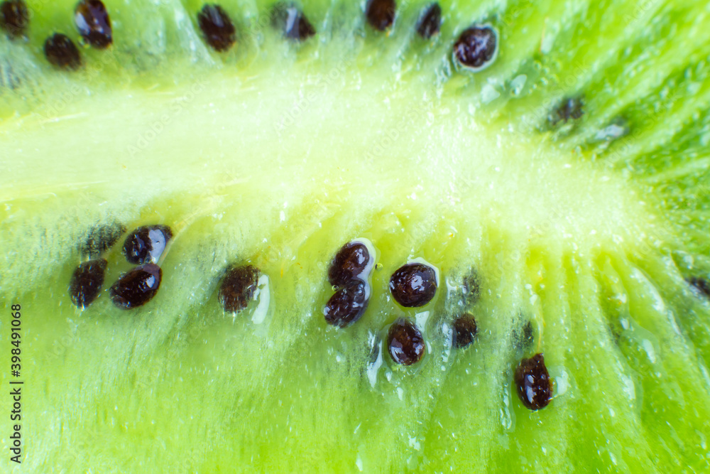 Close up photo of kiwi background. Kiwi fruit cut in half with seeds ...