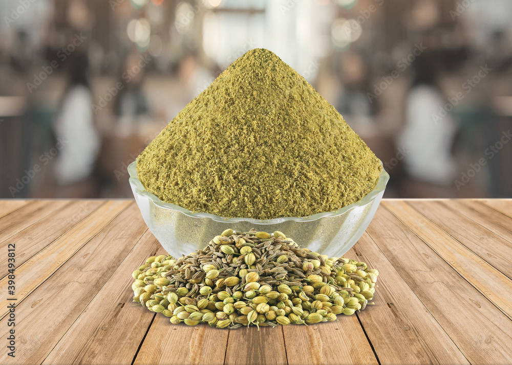 Coriander Powder (Dhaniya Powder) in a glass bowl with Coriander Seeds ...
