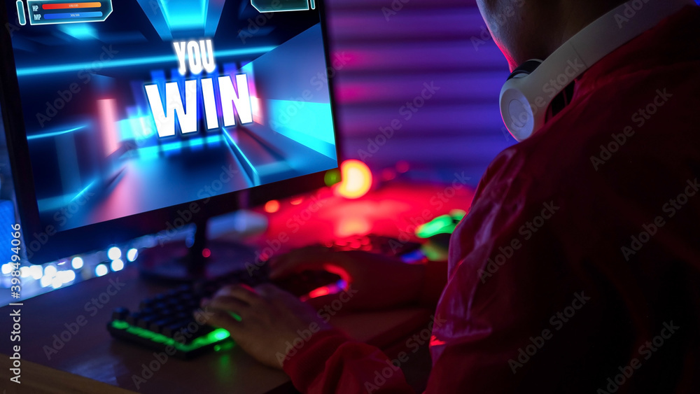 Professional Gamer Playing First-Person Shooter Online Video Game on ...