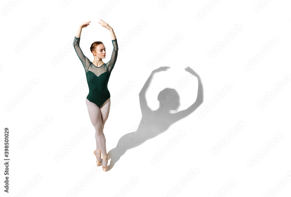 Beautiful young girl ballet dancer isolated over white background with ...