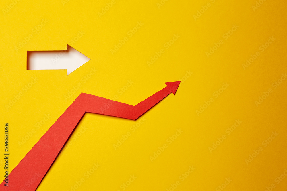 Red color arrow cutted from paper made as graph showing growth of stock ...