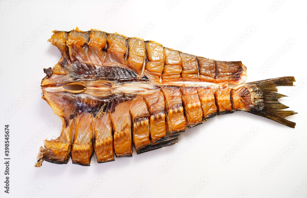 cold-smoked silver carp fish on a white background. salty snacks to ...