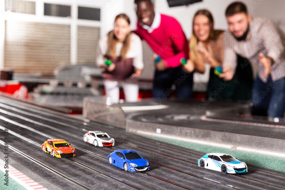 Models of race cars on the track in game room Stock Photo | Adobe Stock