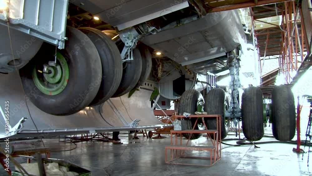 Maintenance of landing gear of the Il-76 aircraft. Chassis doors open ...