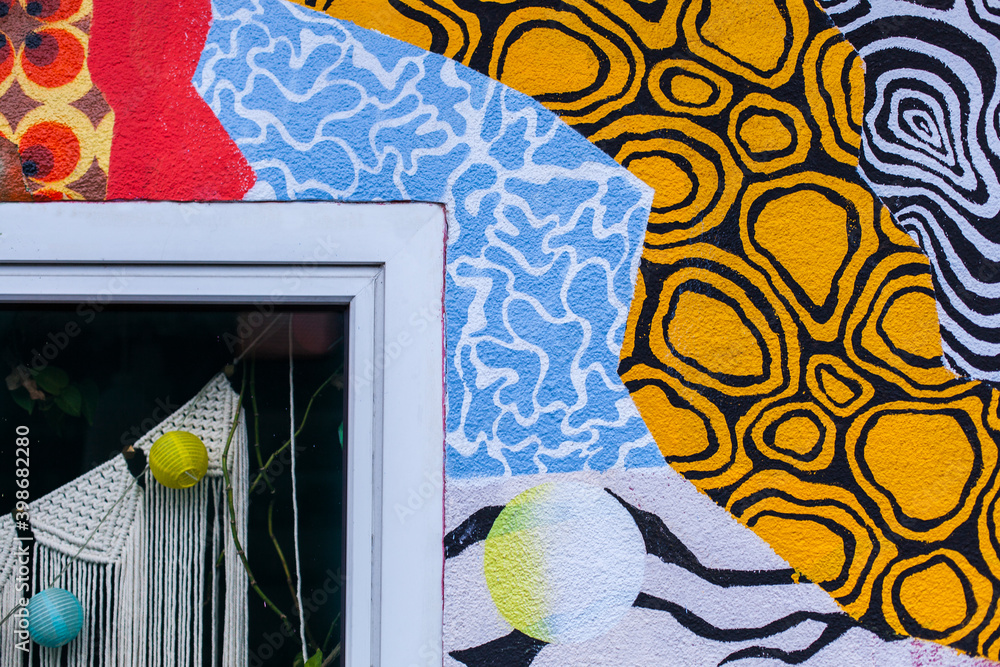 Colorful facade paints on house wall with window. Wall paint in all ...