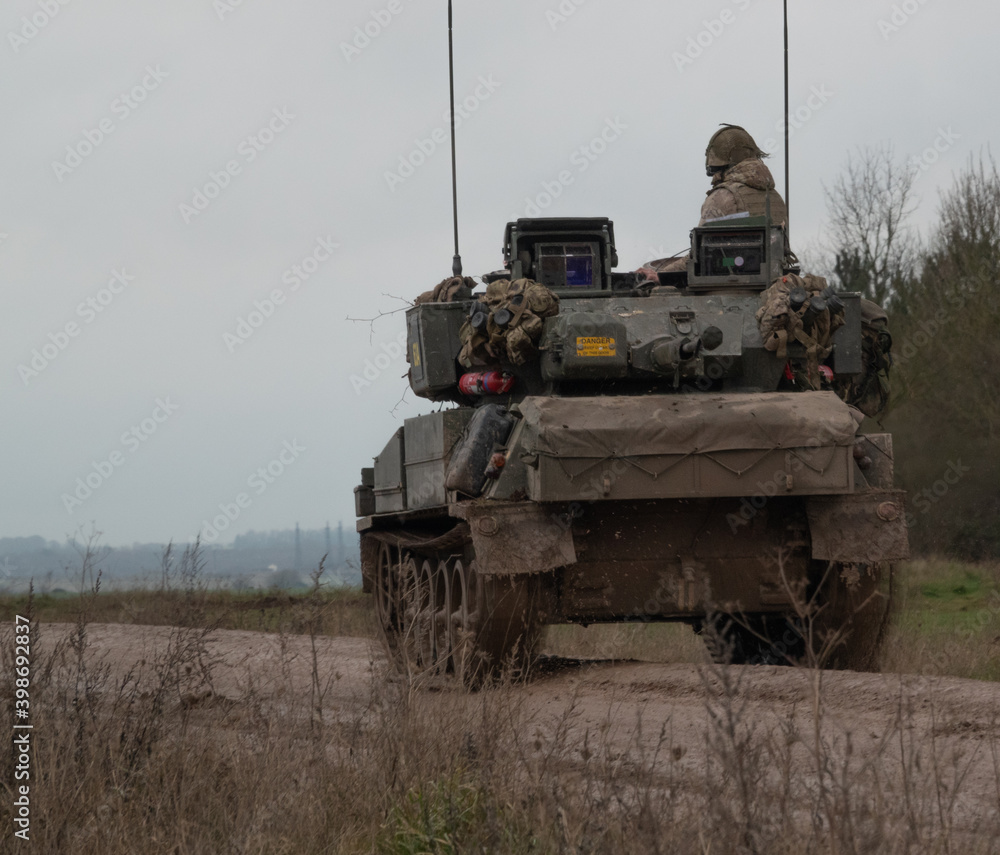 british army scimitar FV107 light tank reversing at high speed during a ...