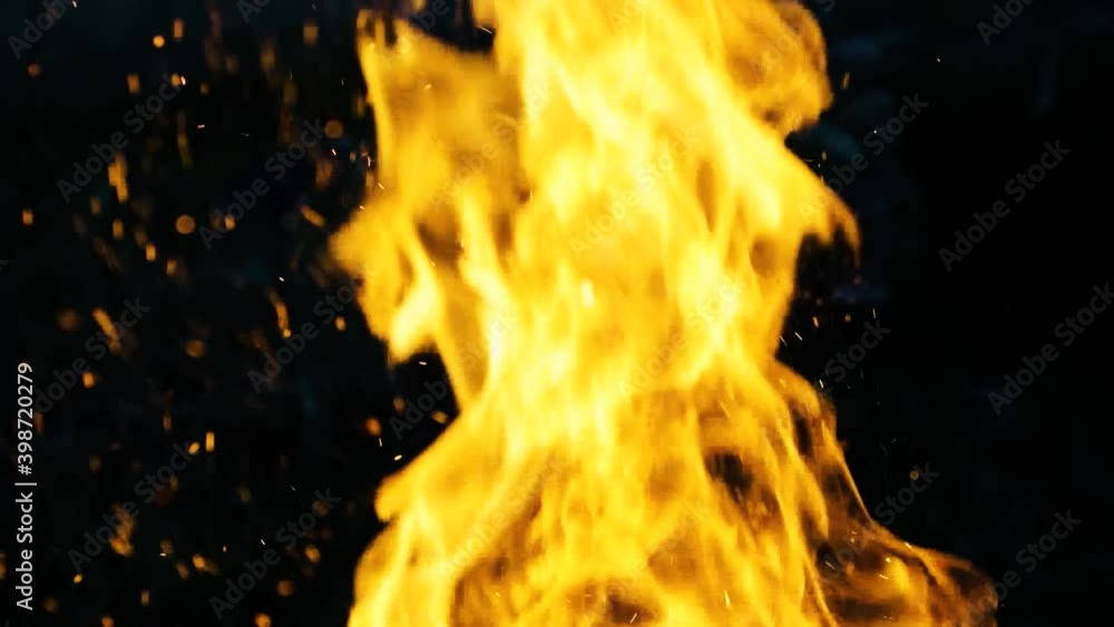 Vidéo Stock Burning hot firewoods fire sparks on a dark background ...