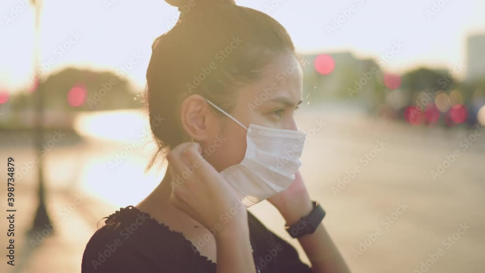 Beautiful woman wearing a surgical mask outdoor, covid-19 , health and ...