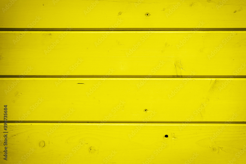 Yellow wood background toned in main colour of the year 2021 ...