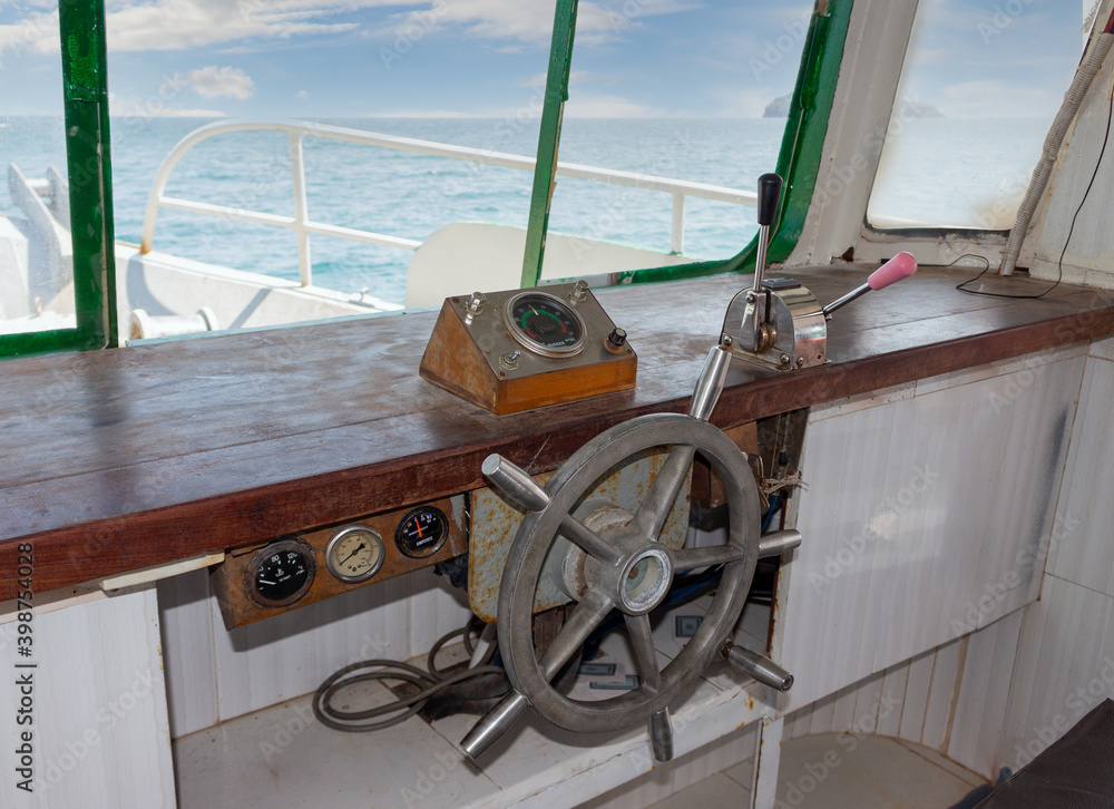Steering wheel and dashboard on tourist boat Stock Photo | Adobe Stock