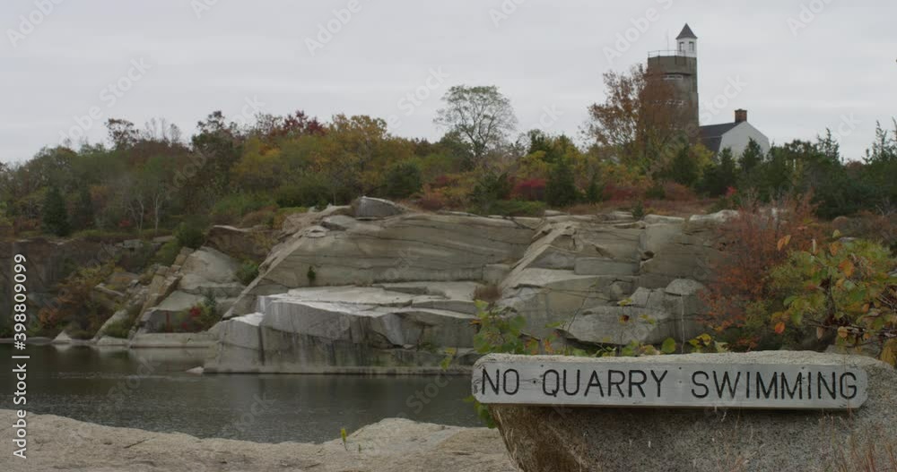 A fall scene at a lake in Halibut Point state park and a lighthouse in ...
