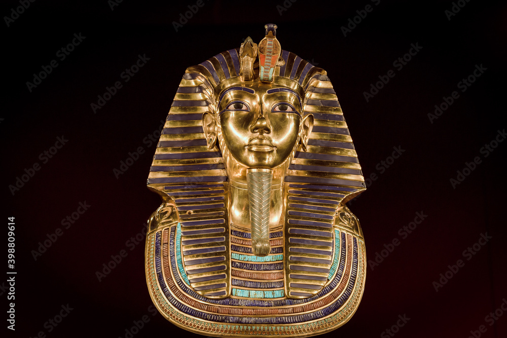Replica of the funerary mask of Tutankhamun. Isolated on black ...