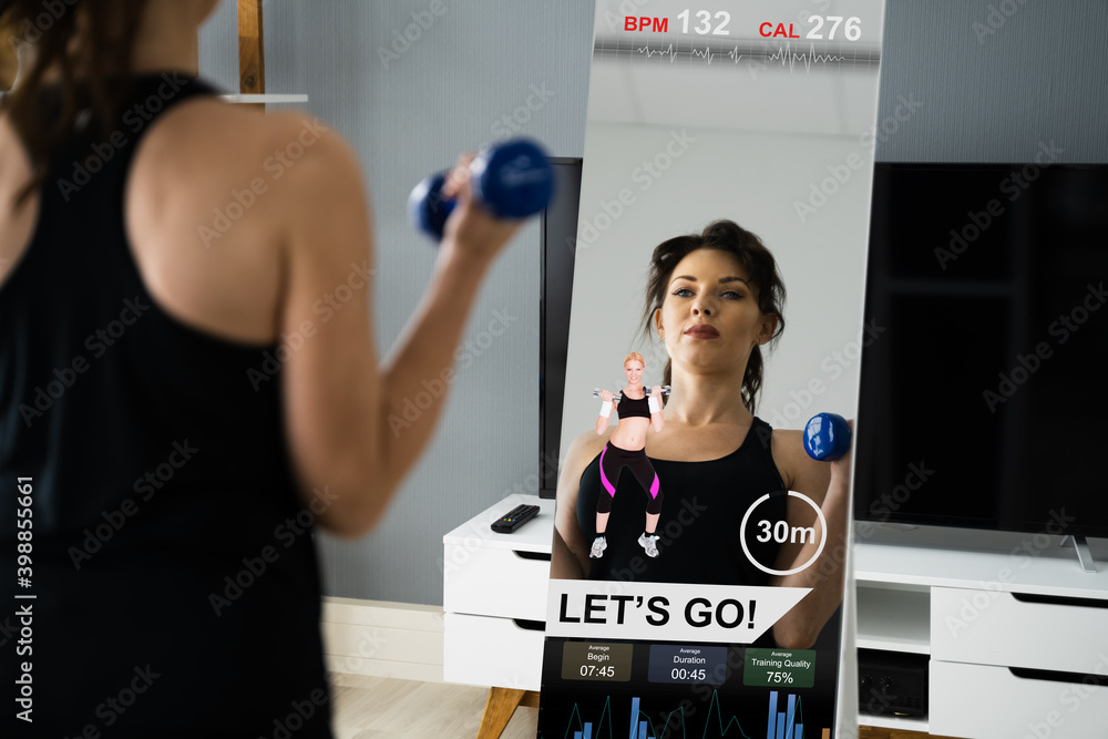 Fitness Exercise At Home Using Smart Mirror Stock Photo | Adobe Stock