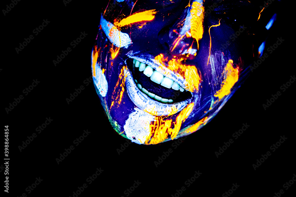 UV Ultra Violet portrait of a female face with an isolated subject and ...