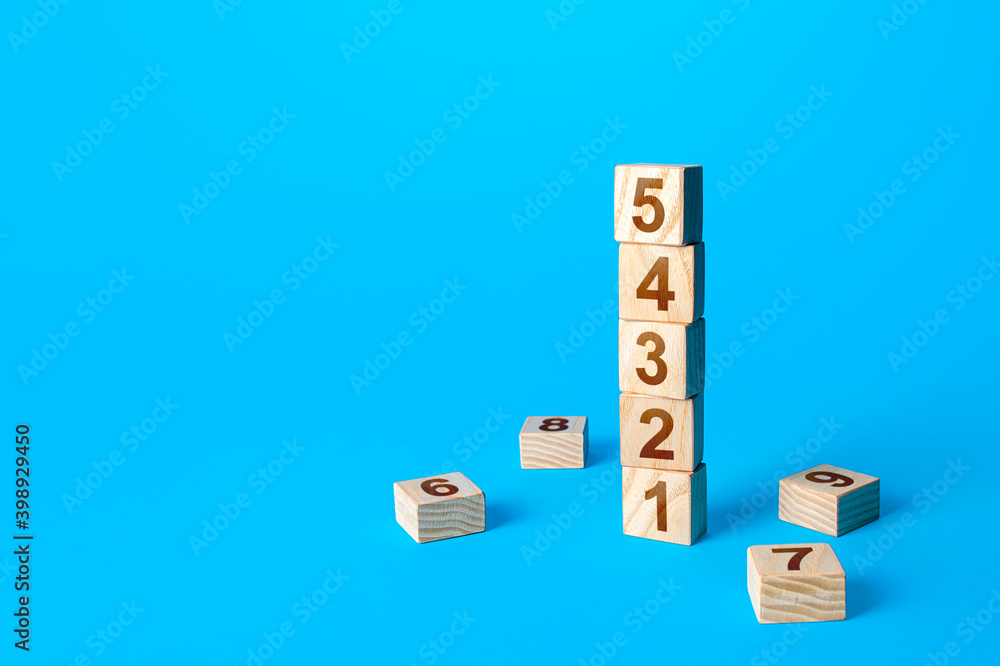 Numbers tower of wooden blocks. Simple steps. Organization and ...