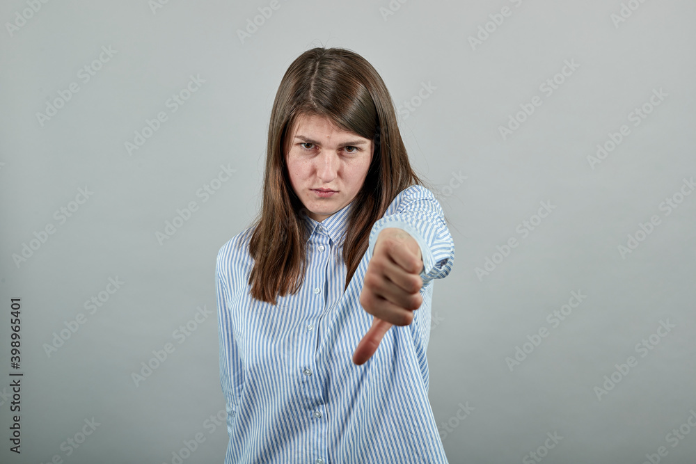 Human hand thumb down, no okay sign, angry face, negative gesture ...