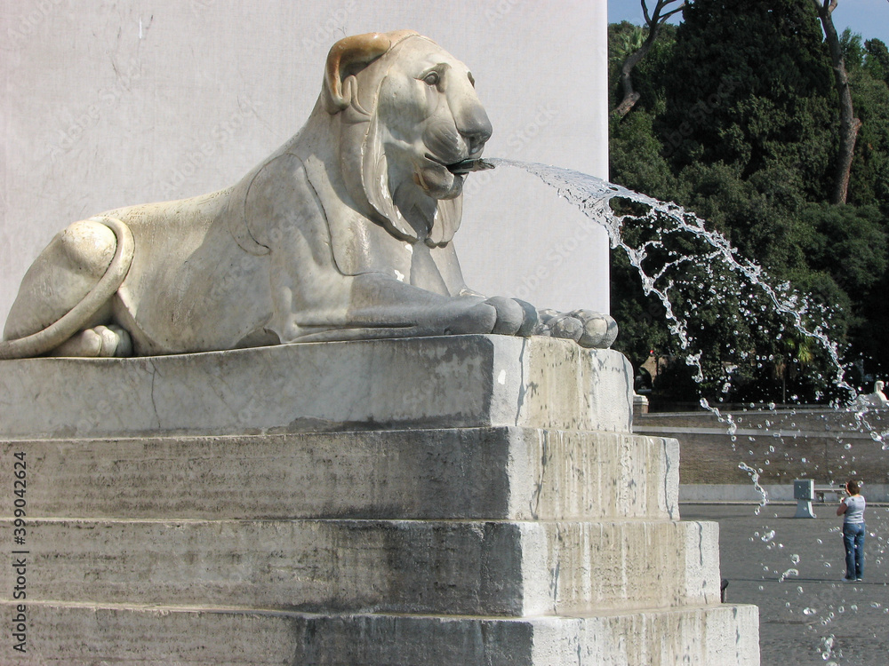 Rome, Italy - A statue of a lion spitting water Fontana dell'Obelisco ...