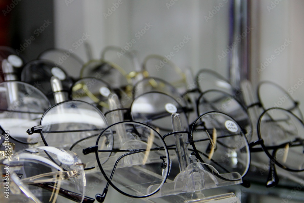 Eyeglasses in the window of a specialty optics store. Eye glasses on ...