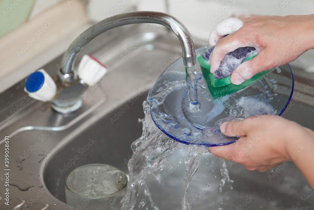 Washing glassware with a sponge and detergent. Close-up. No face Stock ...