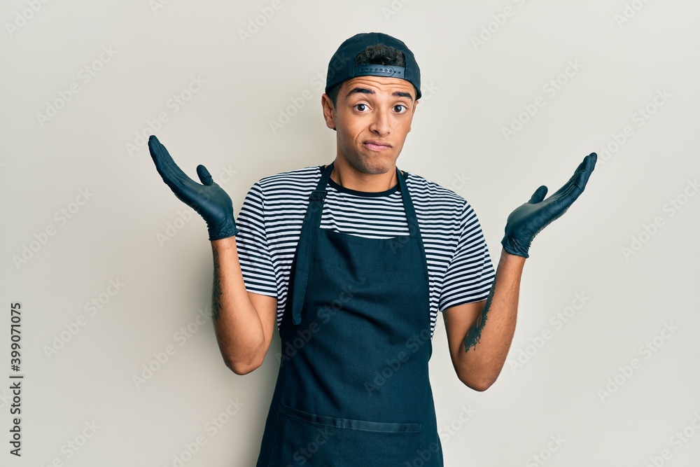Young handsome african american man tattoo artist wearing professional ...