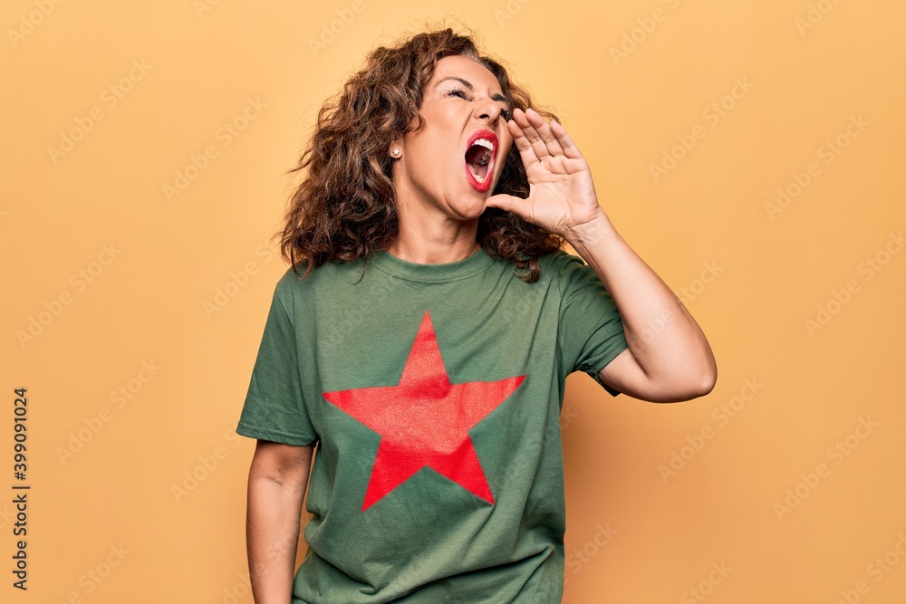Middle age beautiful woman wearing t-shirt with red star revolutionary ...