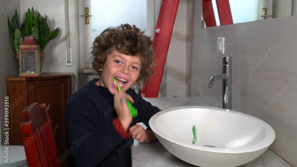 Father teaching little kid teeth brushing and washing his face. Dad and ...