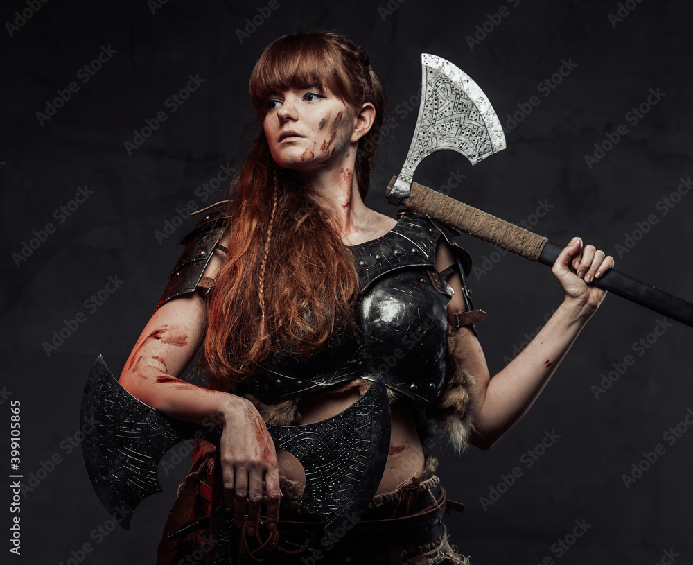 Mighty northern woman warrior in light armour with brown hairs poses in ...