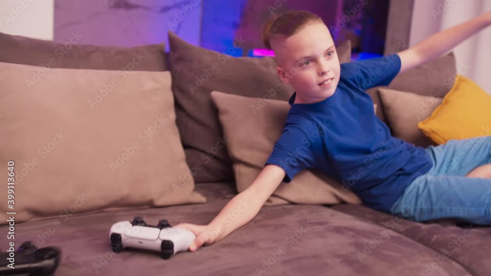 Excited kid playing video games on modern console next gen 2020, new ...