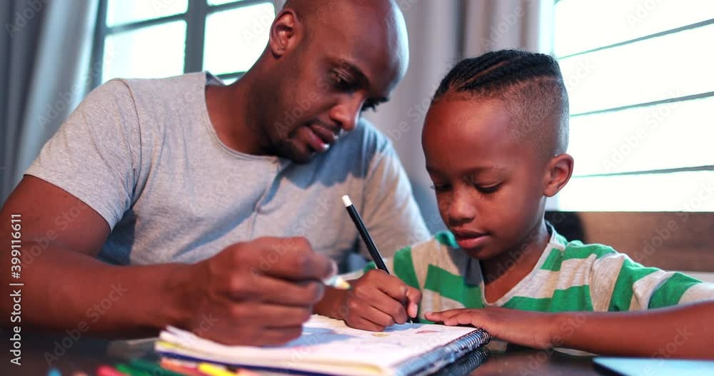 Little boy studying at home doing homework with father help Stock Video ...
