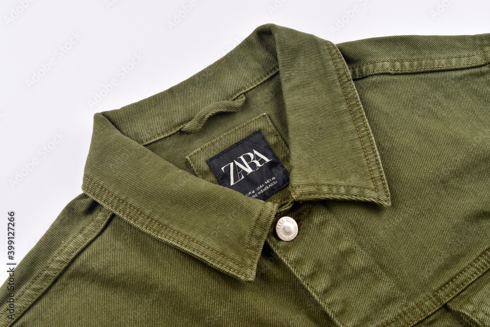 Zara denim jacket on white background, closeup on tag of zara Stock ...