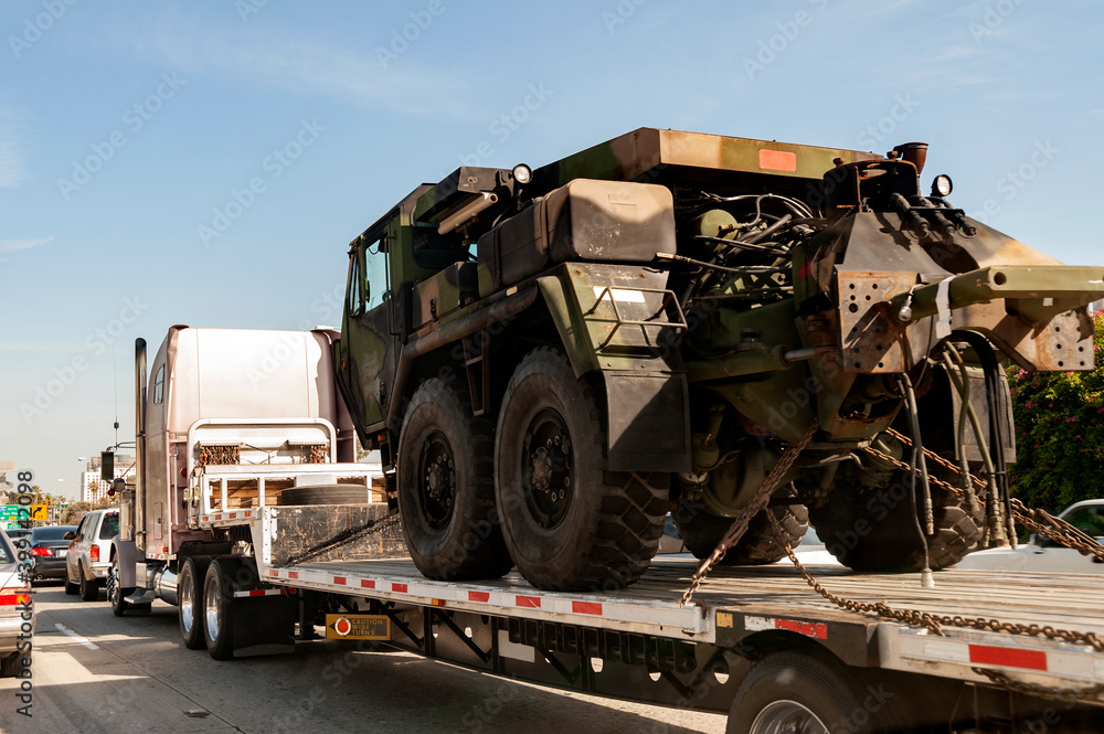 Military transport vehicle being transported Stock Photo | Adobe Stock