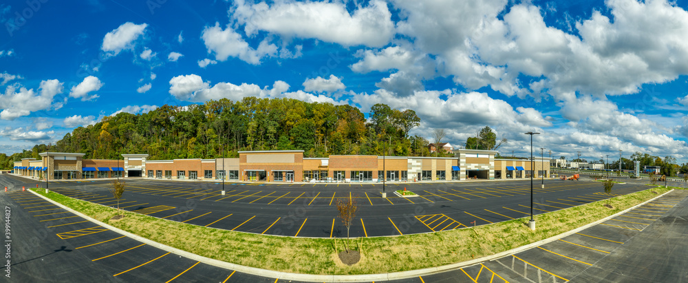 Panoramic view of refurbished American suburban strip mall with no logo ...