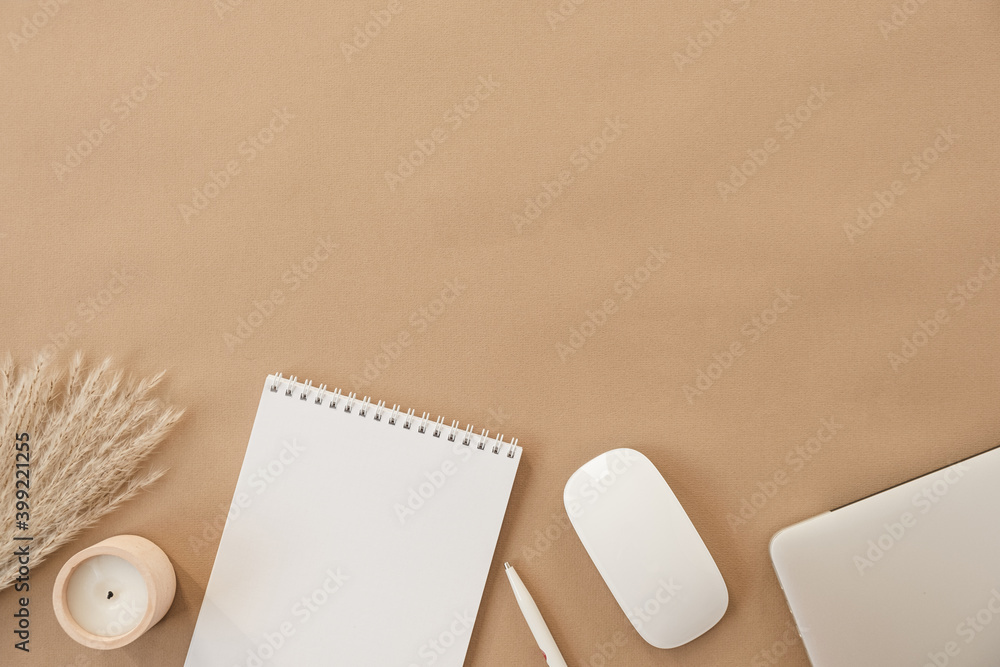Flatlay of spiral flip notebook with blank paper sheet. Laptop, pampas ...