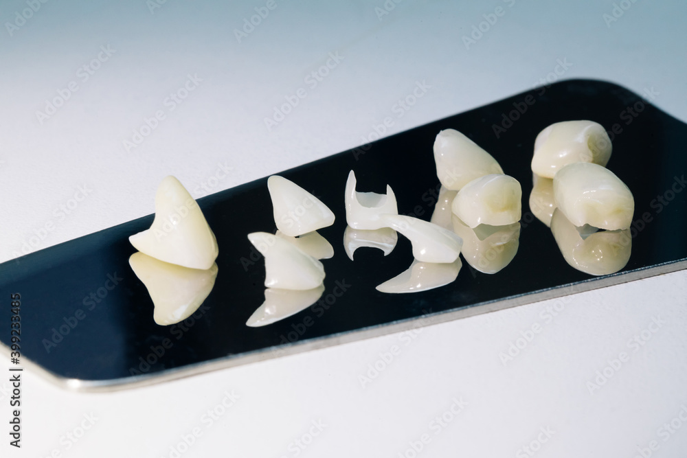 Ceramic tooth with a totally wite background. Ceramic teeth with the ...