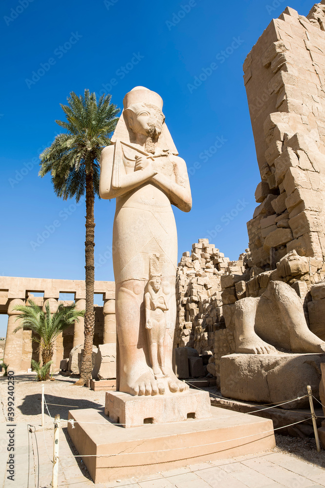 Poster Statue of Ramses II with his daughter Merit-Amon in the temple ...